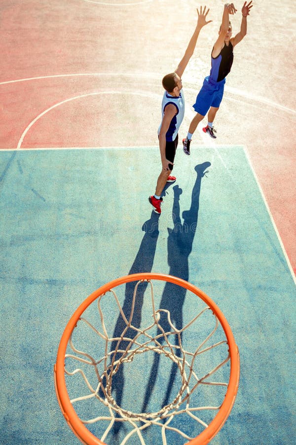 High Angle View of Basketball Player Dunking Basketball in Hoop Stock ...