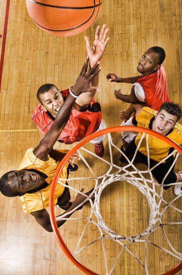 High Angle View of Basketball Player Dunking Basketball in Hoop Stock ...