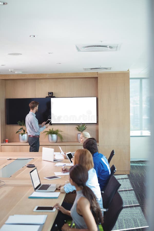 High Angle View of Business People at Conference Table during Meeting ...