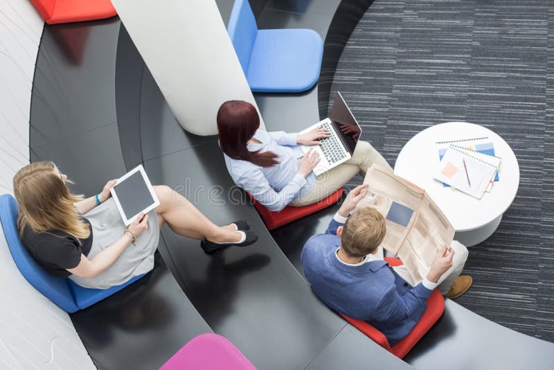 High Angle View of Business People Sitting in Office Lobby Stock Image ...
