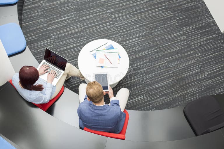 High Angle View of Business People Using Technologies in Office Stock ...