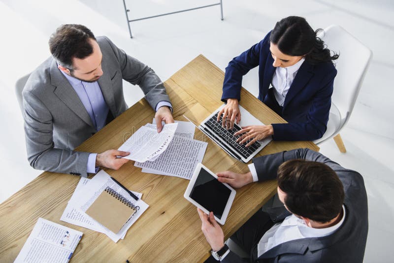 High Angle View of Businesspeople Working with Gadgets Stock Image ...