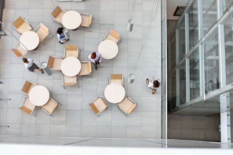 High Angle View of Businesswomen Walking at Office Canteen Stock Photo ...