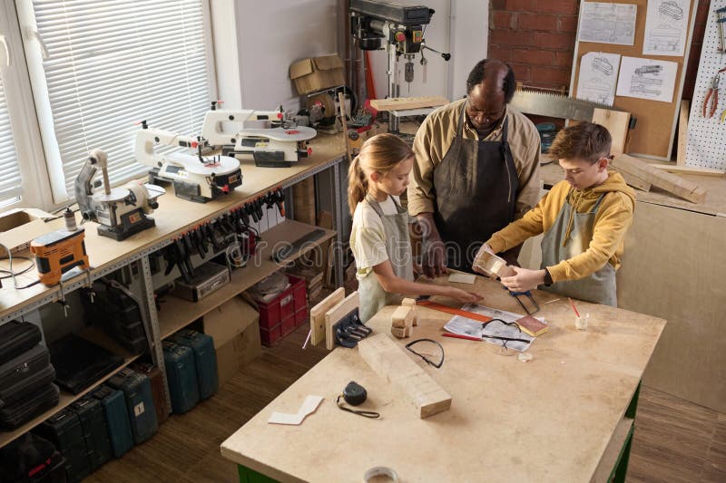 Carpenter Teaching Kids in Workshop for Children Stock Photo - Image of ...