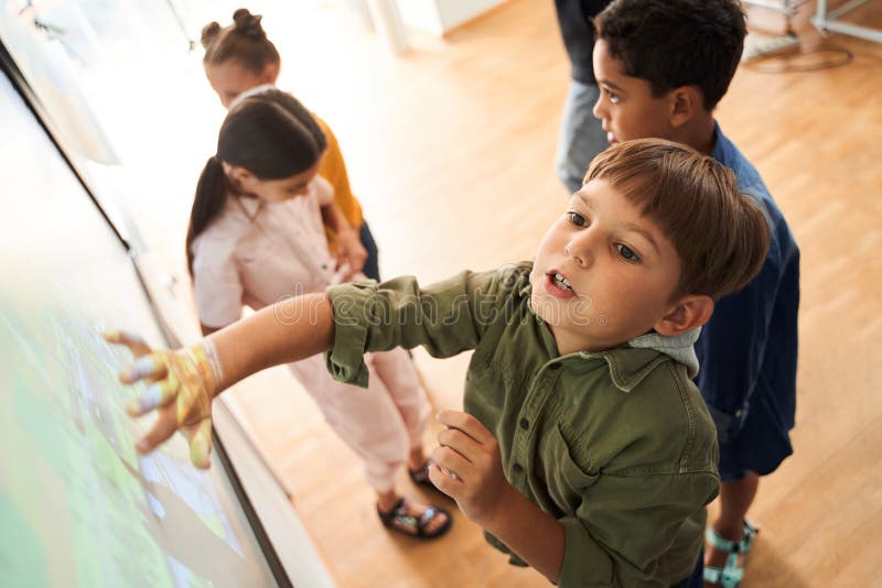 High Angle View of the Cheerful Caucasian Pupil Using Interactive ...