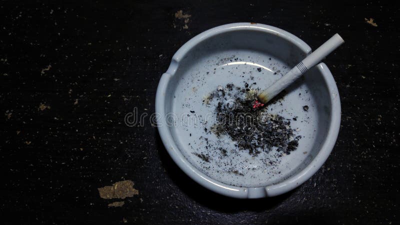 High Angle View of Cigarette in Ashtray on Black Background Stock Image ...