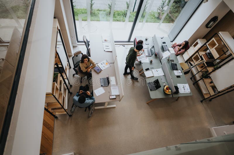 High Angle View of a Collaborative Workspace with Diverse Professionals ...