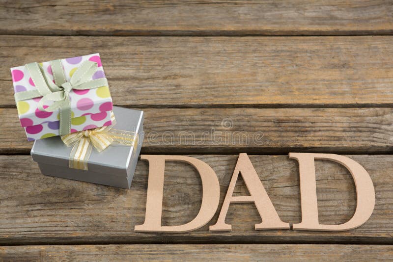 High Angle View of Dad Text by Gift Boxes on Table Stock Photo - Image ...