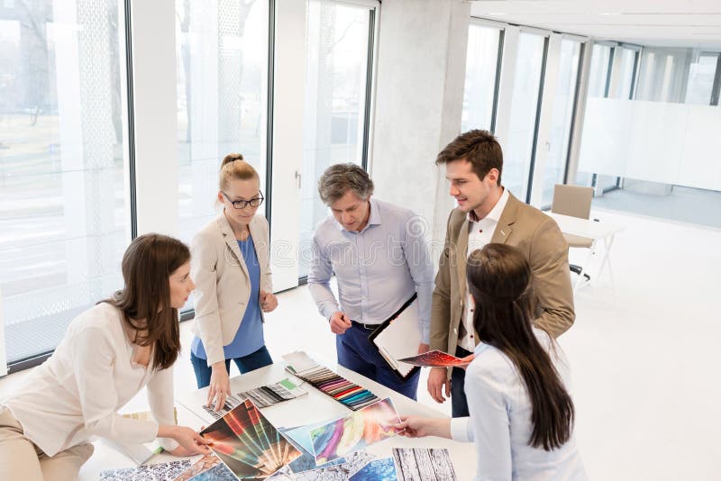 High Angle View of Design Professionals Having Discussion at Table in ...