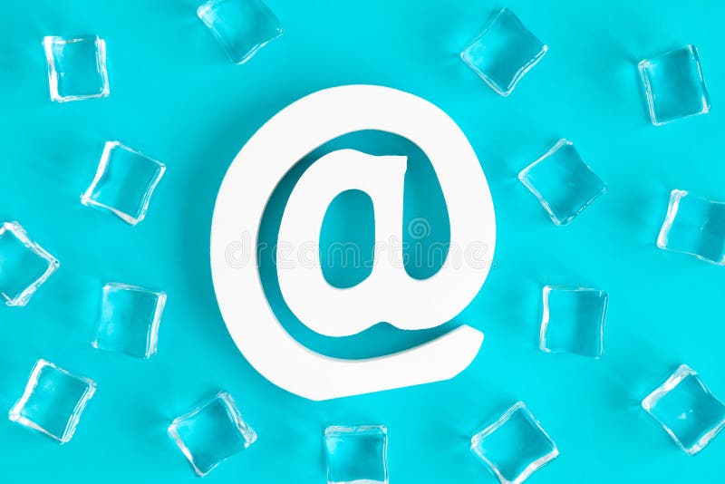 High Angle View of Email Symbol and Ice Cubes Abstract Isolated on Blue ...
