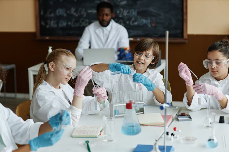 Kids Doing Experiments during Modern Chemistry Class Stock Photo ...