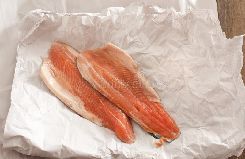 High Angle View of Fish Fillets on White Paper Stock Image - Image of ...