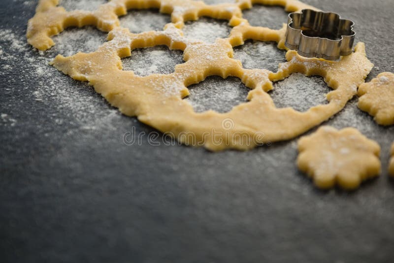 High Angle View of Flower Shape Pastry Cutter on Dough Stock Photo ...