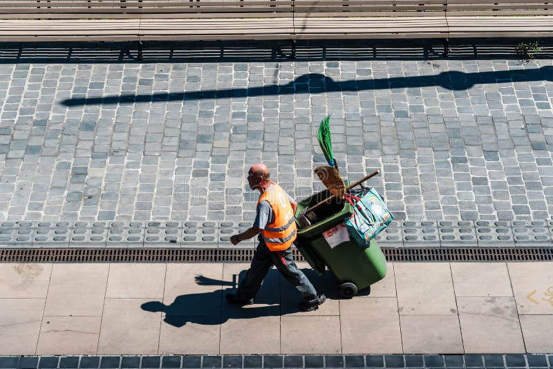 High Angle View of Garbage Man on Street Editorial Stock Photo - Image ...