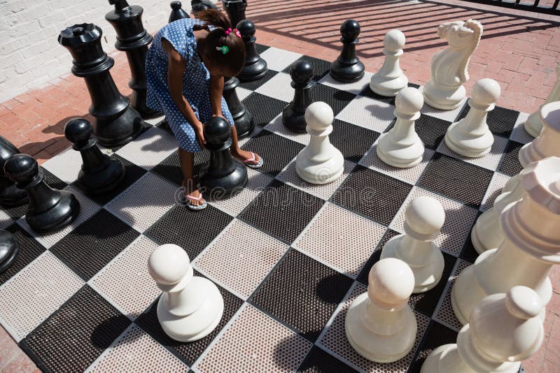 High Angle View of Girl Playing with Chess Pieces Stock Photo - Image ...