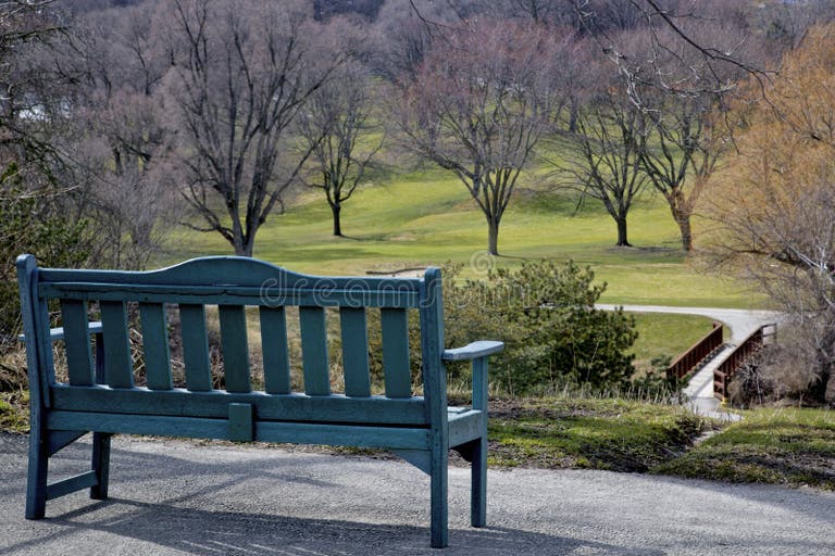 High-angle View of the Golf Course with a Park Bench Stock Image ...