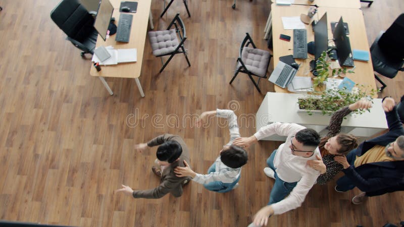 Workers Dancing in Office. Man and Woman Happily Dance because of ...