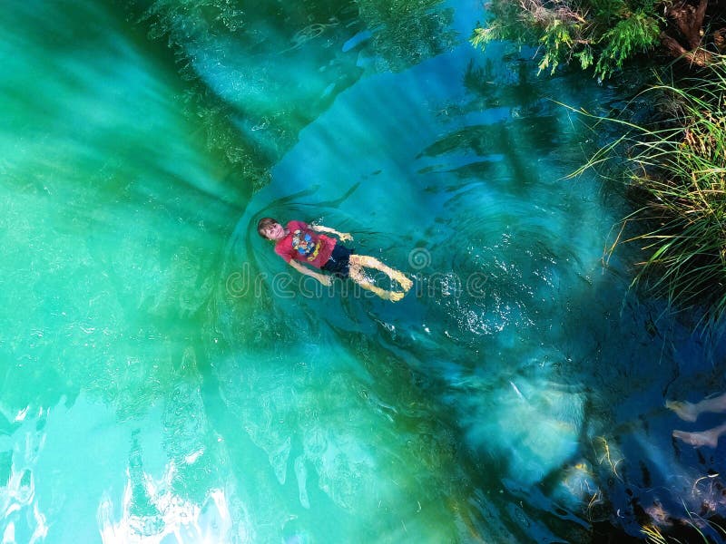 High-angle View of a Little Boy Laying on the Water. Stock Photo ...