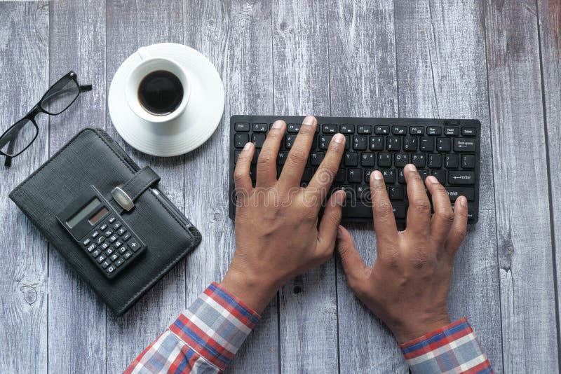 High Angle View of Man Typing on Keyboard on Desk Stock Photo - Image ...
