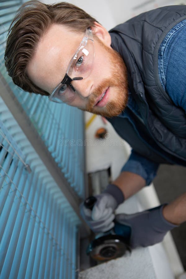 High-angle View Man Using Angle Grinder Stock Image - Image of employee ...