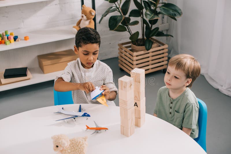 High Angle View of Multicultural Boys Playing with Toys in Classroom ...
