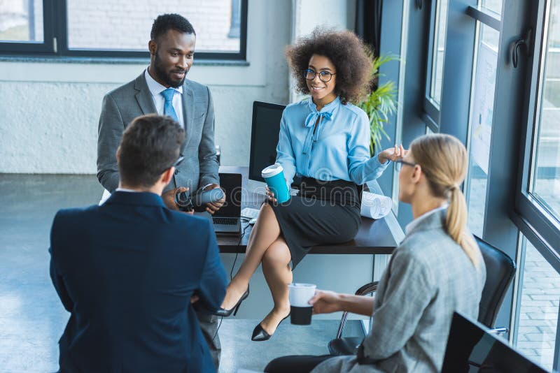 High Angle View of Multicultural Businesspeople Having Coffee Break ...