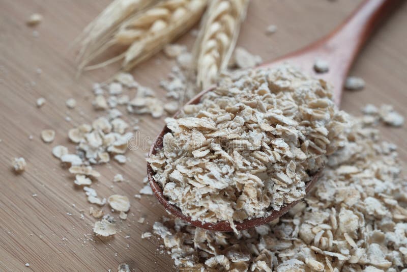 High Angle View of Oats Flakes on Spoon on Table Stock Image - Image of ...