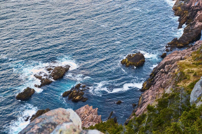 High-angle View of Ocean Waves Crashing on the Rocks of a Cliff Stock ...