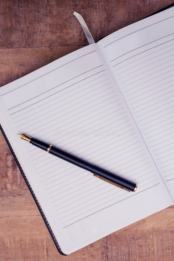 High Angle View of Pen on Open Book Stock Photo - Image of ...