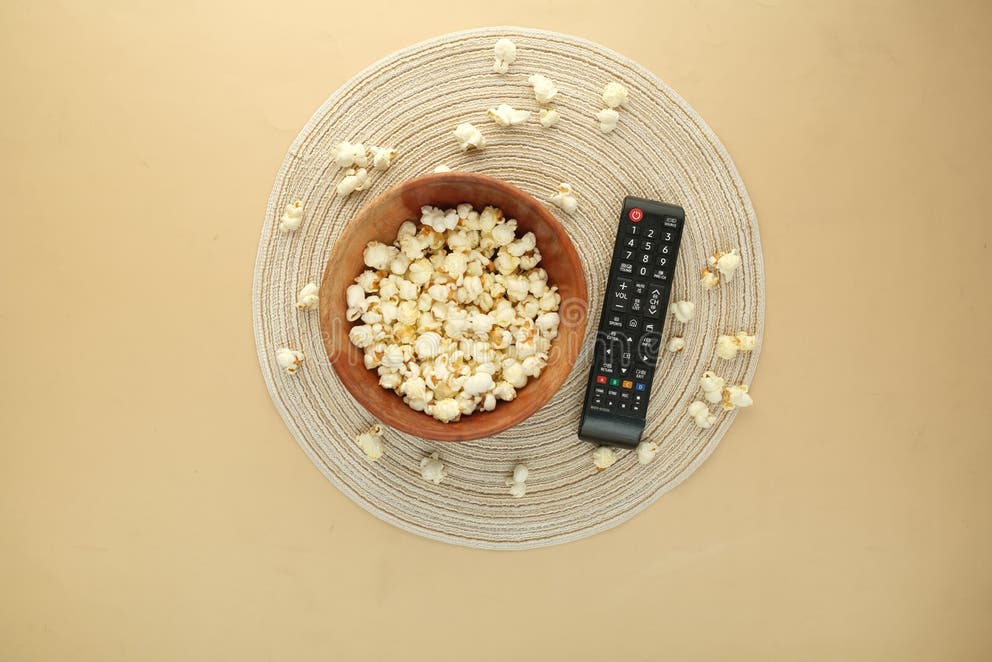 High Angle View of Popcorn and Tv Remote on Table Stock Image - Image ...