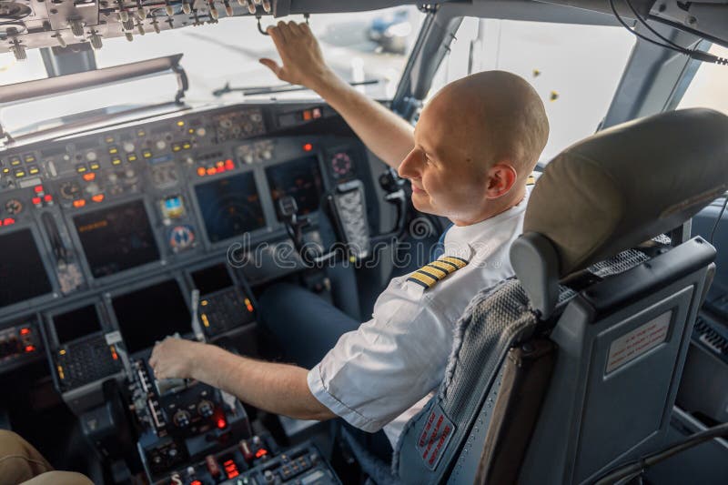 High Angle View of Professional Pilot Sitting in an Airplane Cabin ...
