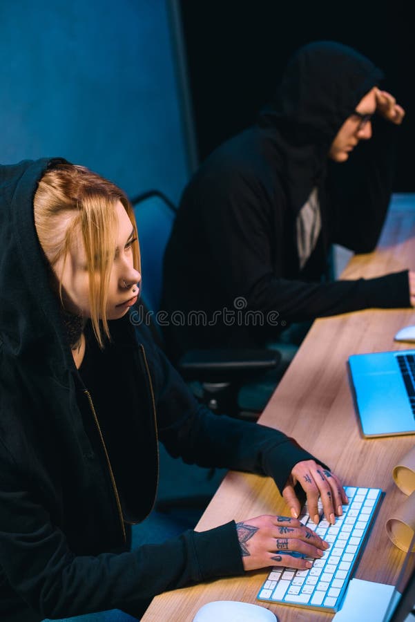 High Angle View of Serious Female Hacker Working on New Malware with ...