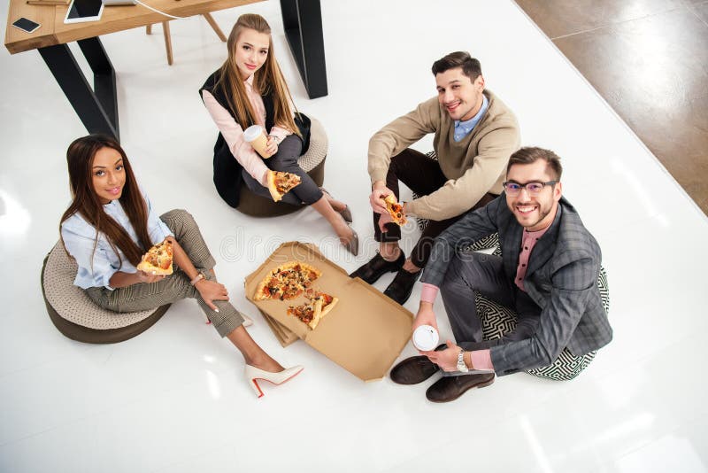 High Angle View of Smiling Multiethnic Business People with Pizza ...