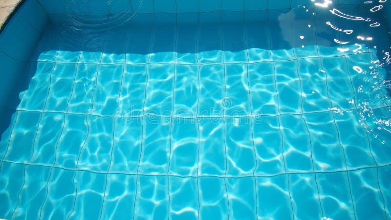 High-Angle View of Sparkling Light Blue Swimming Pool Water with Light ...