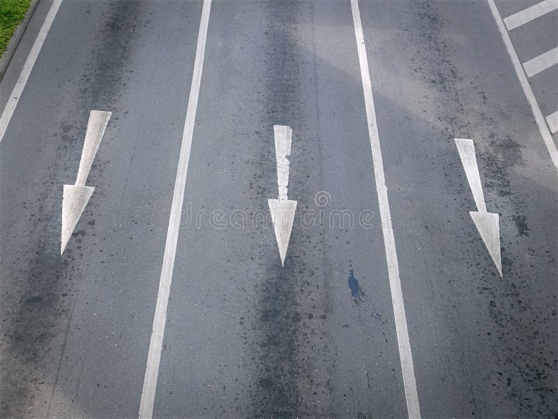 High Angle View of Traffic Arrows on Three Lanes Stock Photo - Image of ...