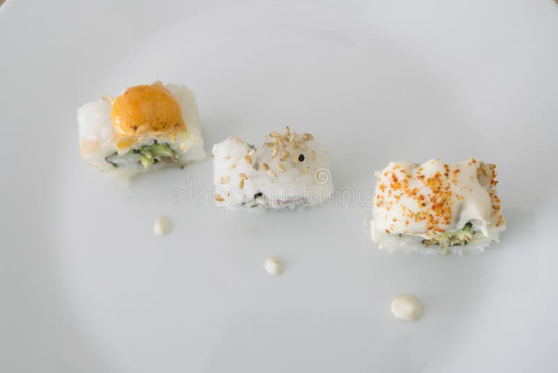 High Angle View of Sushi in a Plate Under the Lights Isolated on a Grey ...