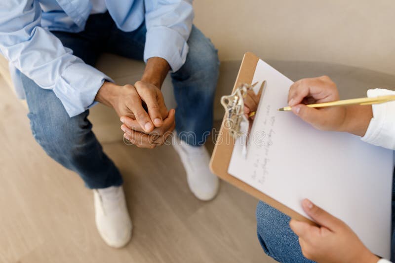 High Angle View of Therapist Taking Notes during Therapy Session Stock ...