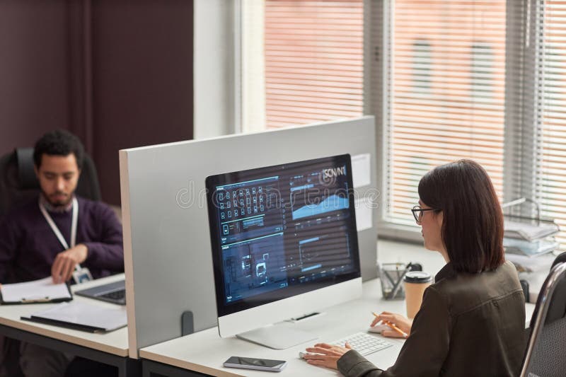Two Office Workers at Desk with Partition Wall, Focus on Data on ...