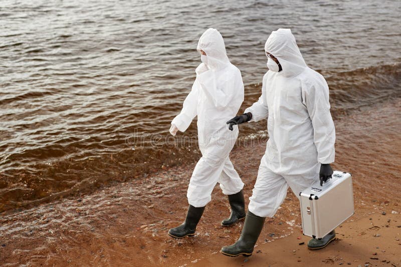 Two Scientists in Protective Suits Outdoors Stock Image - Image of ...