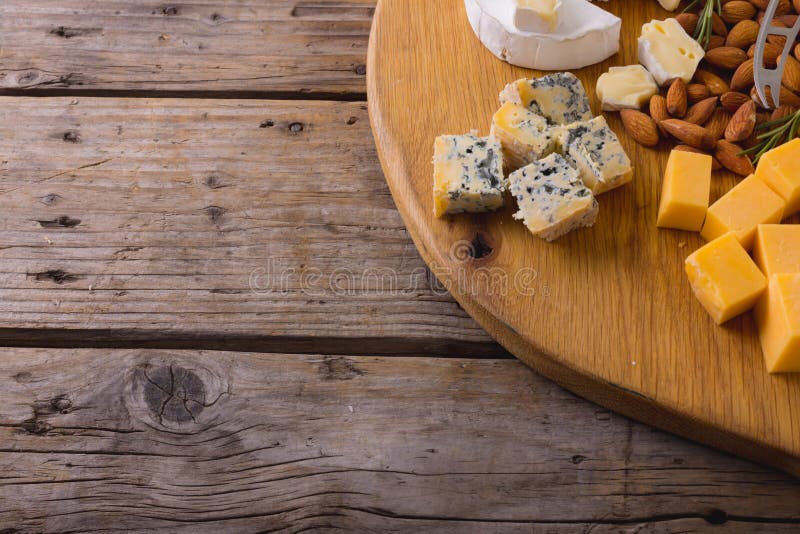 High Angle View of Various Cheese with Almonds on Table, Copy Space ...