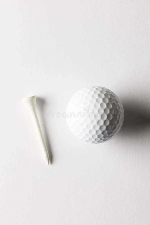 High Angle View of White Golf Ball and Golf Tee with Copy Space on ...