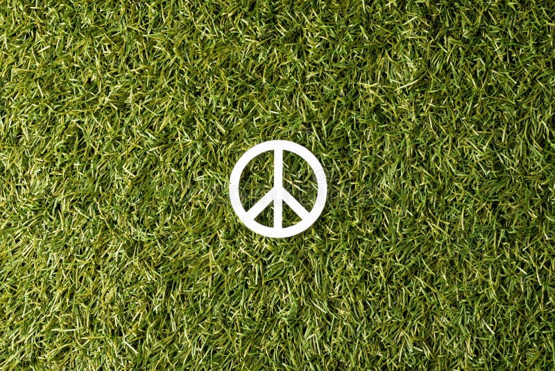 High Angle View of White Peace Sign with Copy Space on Grass Background ...