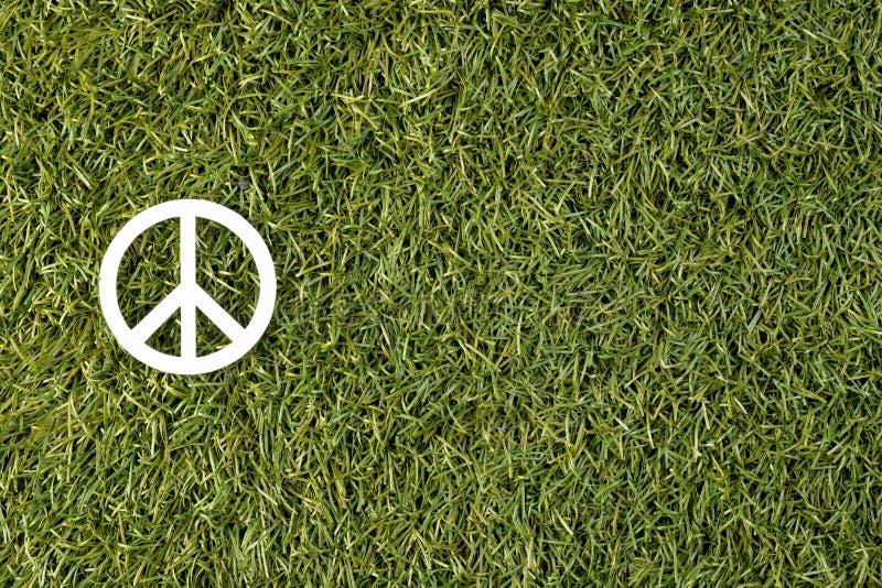 High Angle View of White Peace Sign with Copy Space on Grass Background ...