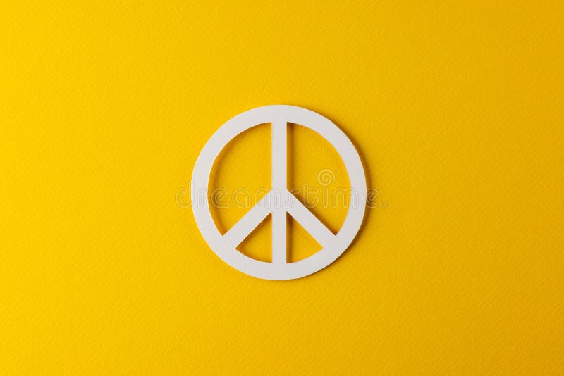 High Angle View of White Peace Sign with Copy Space on Yellow ...