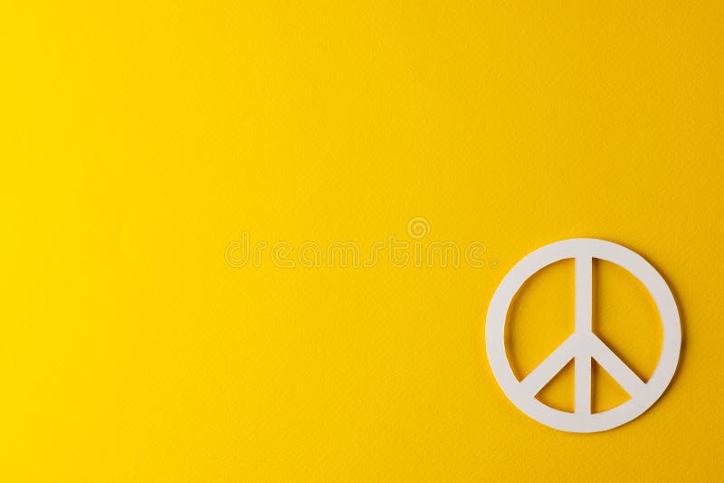 High Angle View of White Peace Sign with Copy Space on Yellow ...