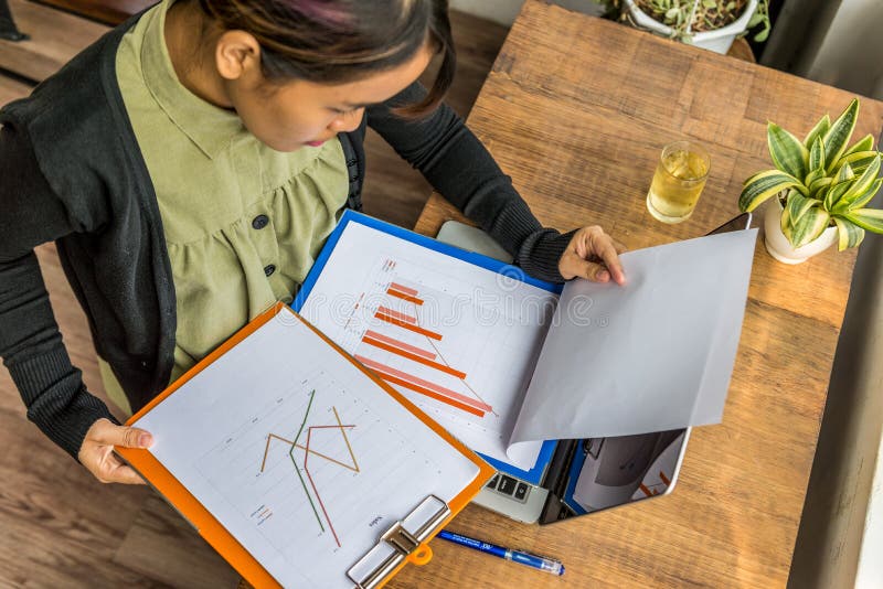 High Angle View of Woman Working on Sales Chart Document Stock Image ...