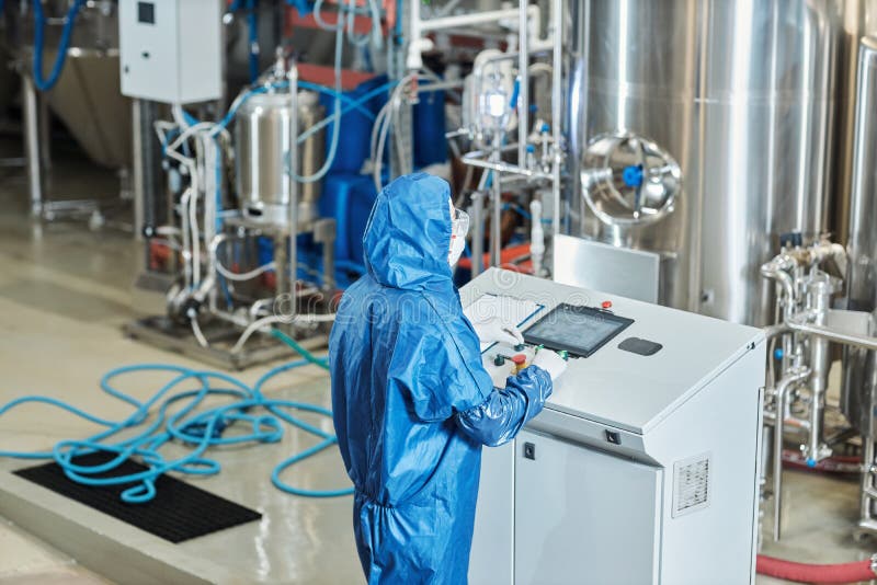 High Angle View at Worker in Protective Gear Operating Equipment at ...