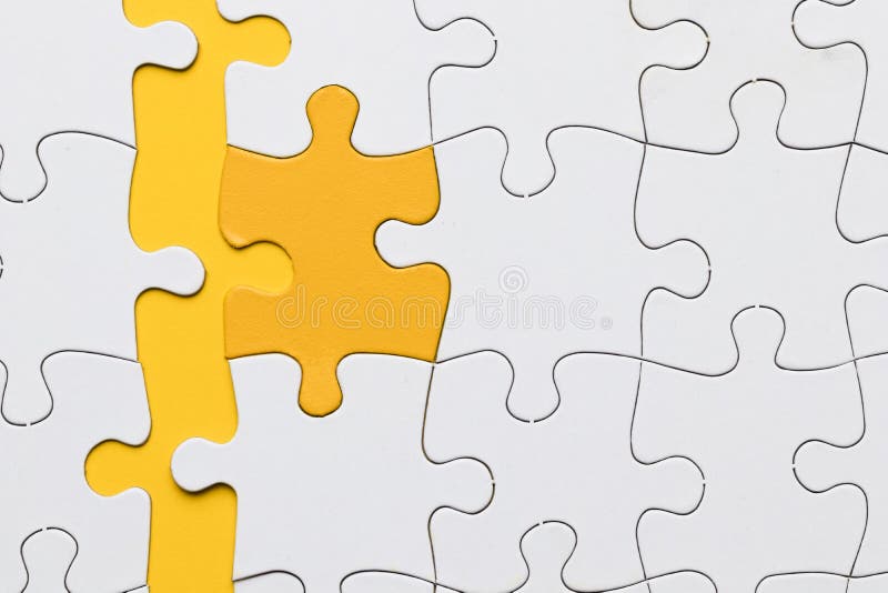 High Angle View Yellow Puzzle Piece Arranged with White Pieces. High ...