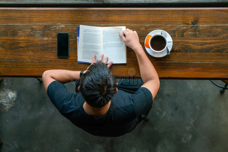 High Angle View of Man Reading Book Stock Image - Image of horizontal ...