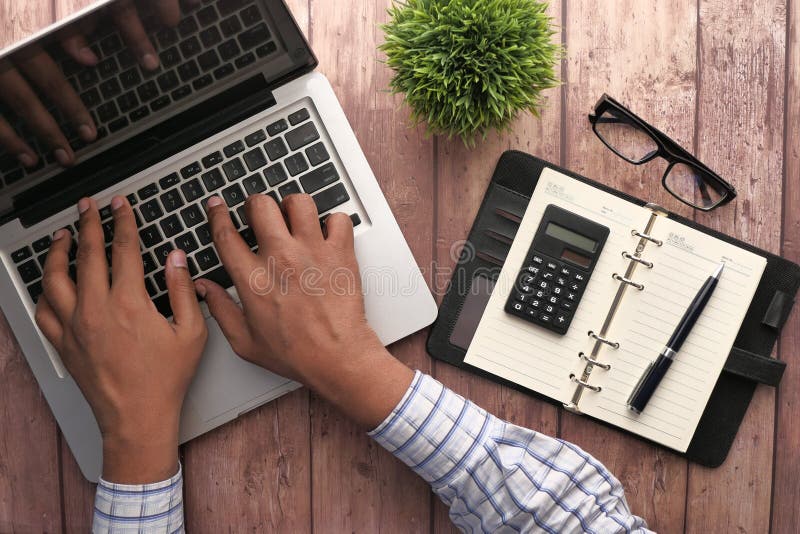 High Angle View of Young Man Typing on Laptop. Stock Image - Image of ...